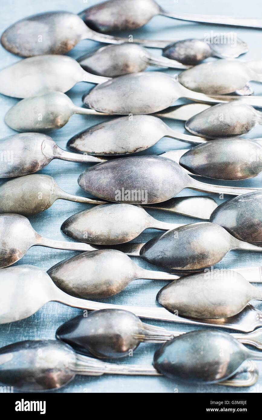 Rows of spoons face down Stock Photo - Alamy