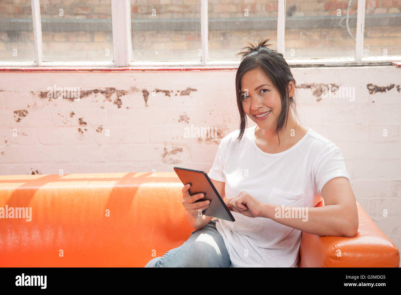Kindle on sofa hi-res stock photography and images - Alamy