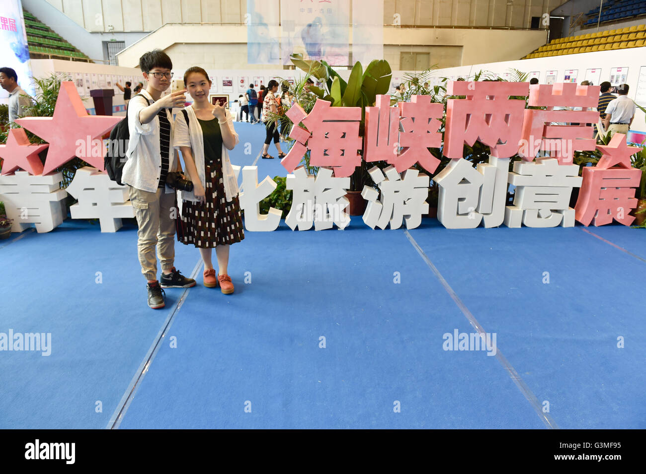 Gutian, China's Fujian Province. 13th June, 2016. Two young people pose ...