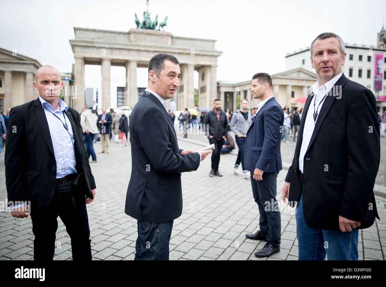 Security guards of the German Criminal Police Office stand next to Cem ...