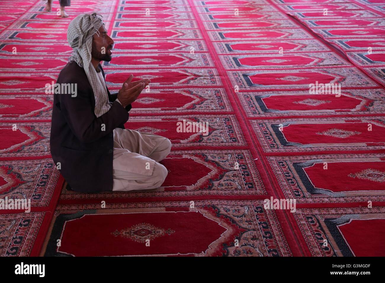 Ghazni, Afghanistan. 13th June, 2016. An Afghan man prays at a mosque ...