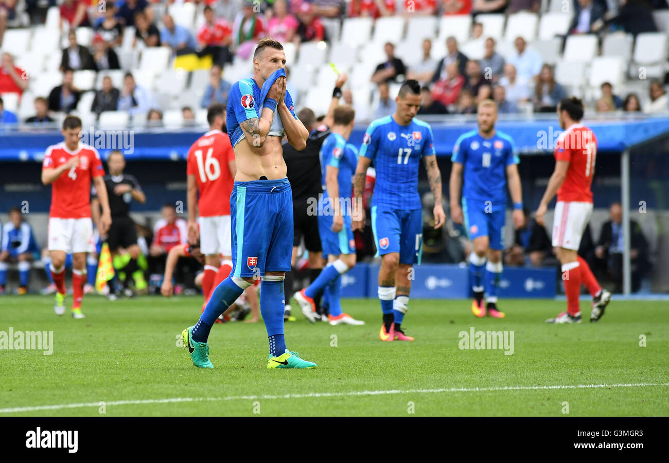 Jan Durica of Slovakia wipes his face with his shirt in the second half ...