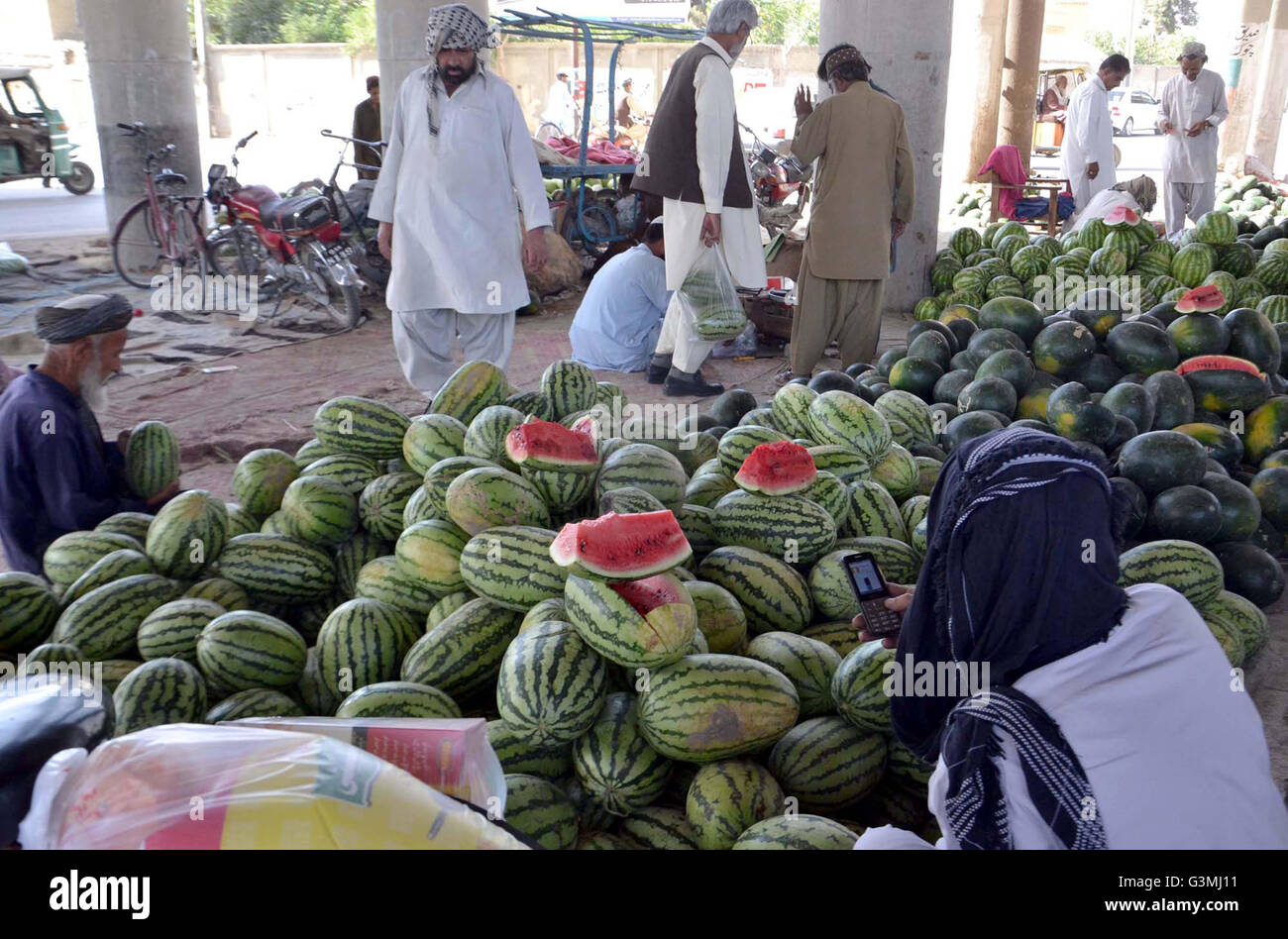 Quetta, Pakistan. 13th June, 2016. Vendor selling water melon to earn ...