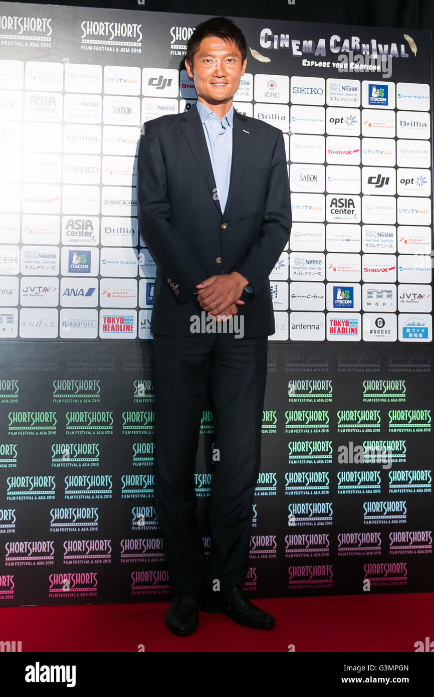 Former volleyball player Kentaro Asahi poses for the cameras on the red ...