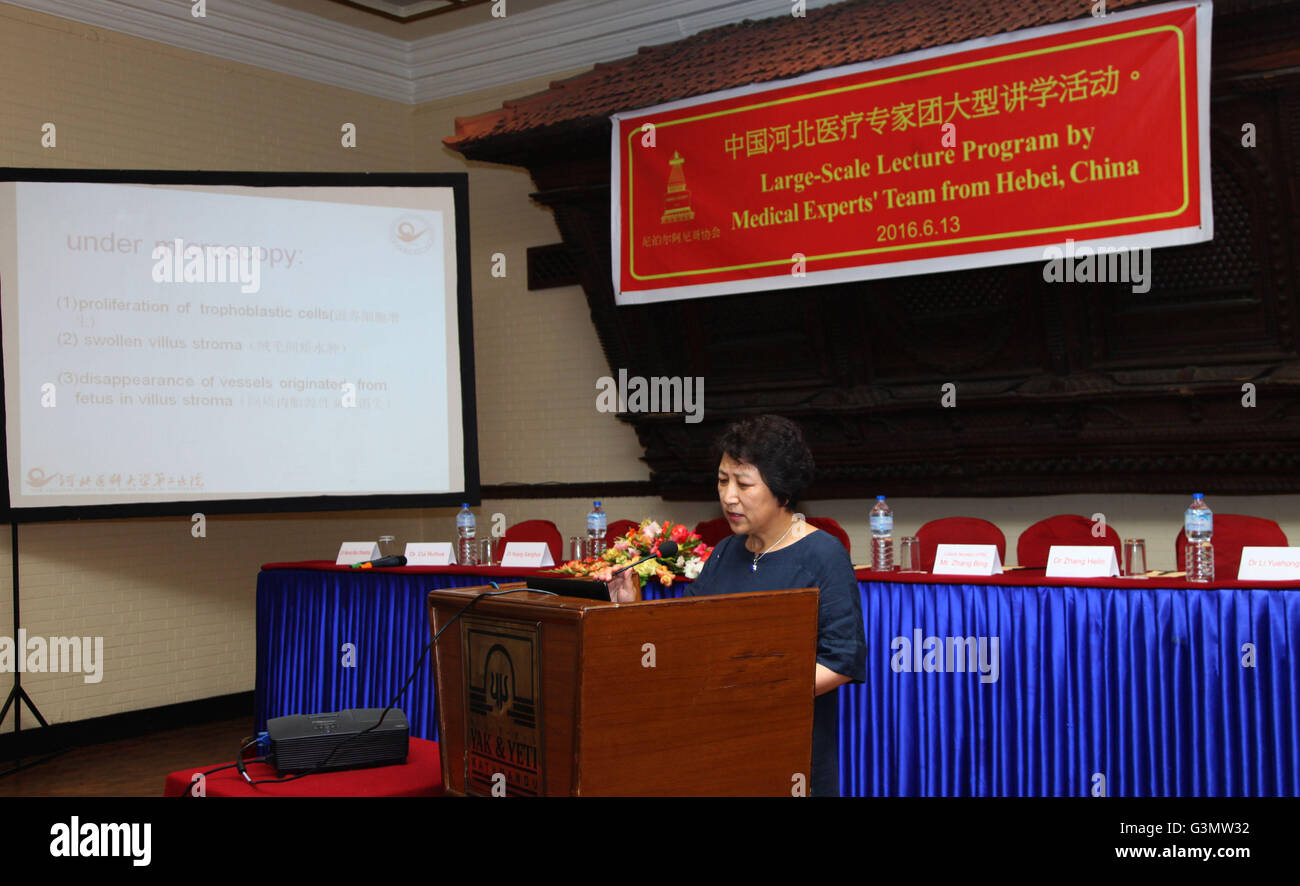 Kathmandu, Nepal. 13th June, 2016. A Chinese doctor makes a ...