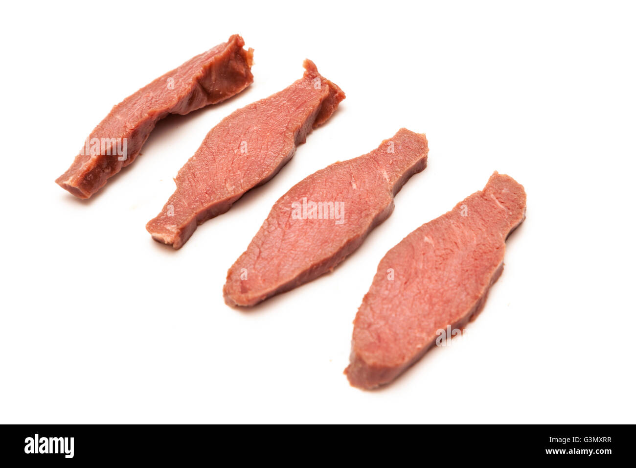 Cooked Ostrich (Struthio camelus) meat steaks isolated on a white ...
