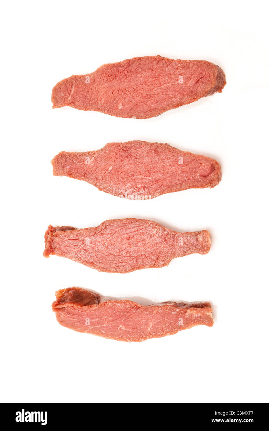 Cooked Ostrich (Struthio camelus) meat steaks isolated on a white ...