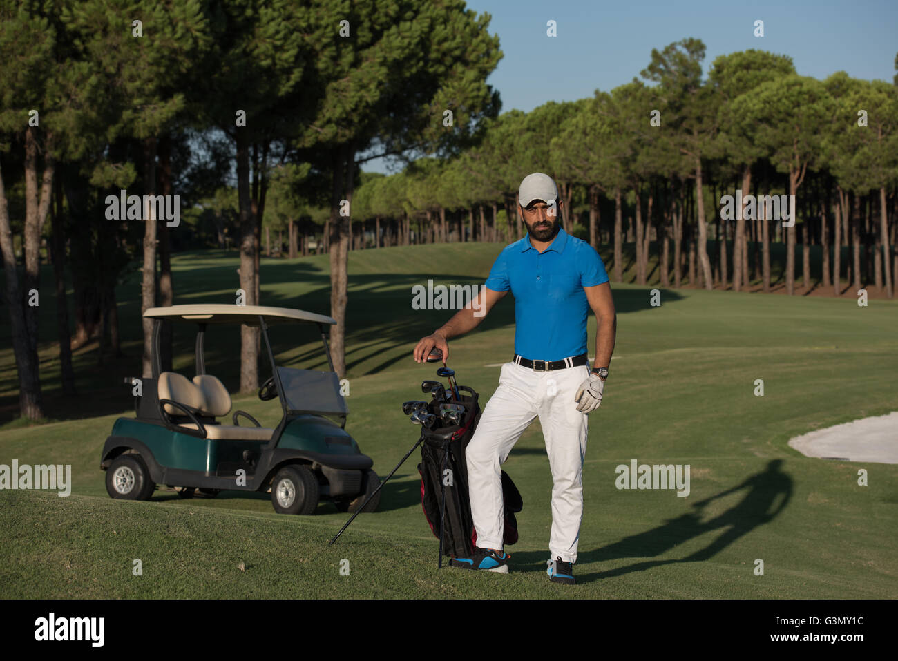 handsome middle eastern golfer portrait at golf course at sunny day ...