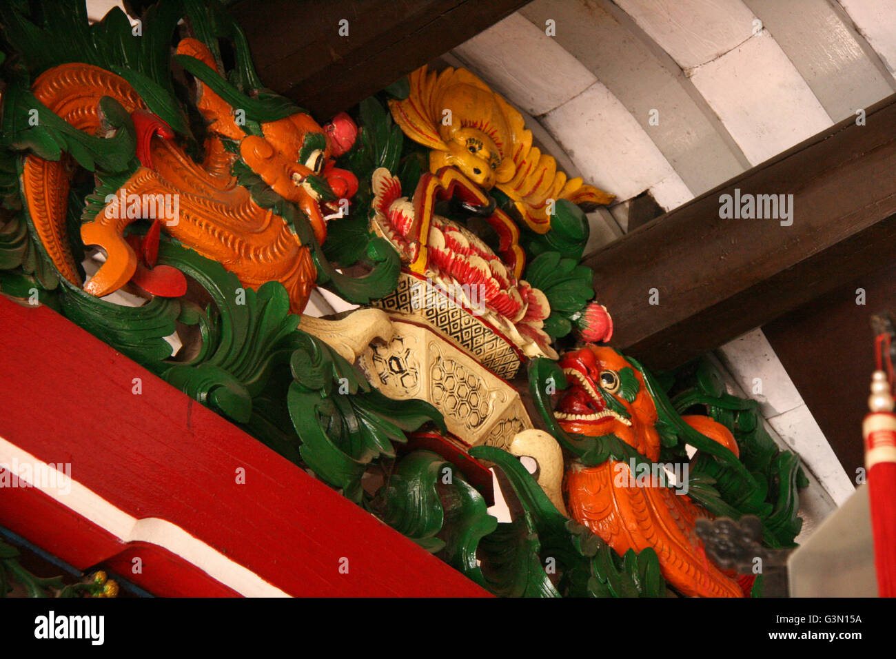 Sculptured dragons and bat decorating the ceiling of a Chinese pavilion ...