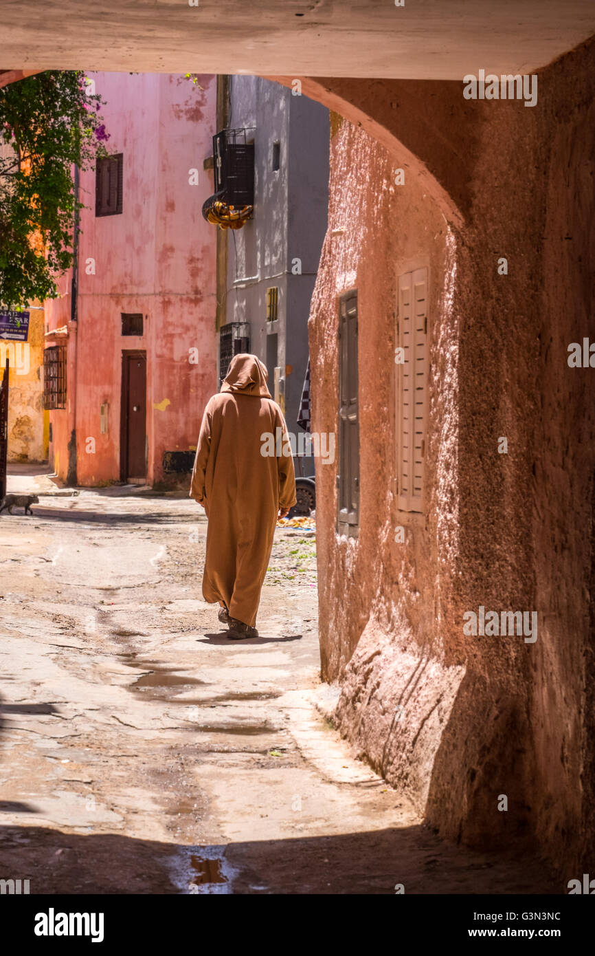 Moroccan man in traditional dress In the medina of the walled coastal ...