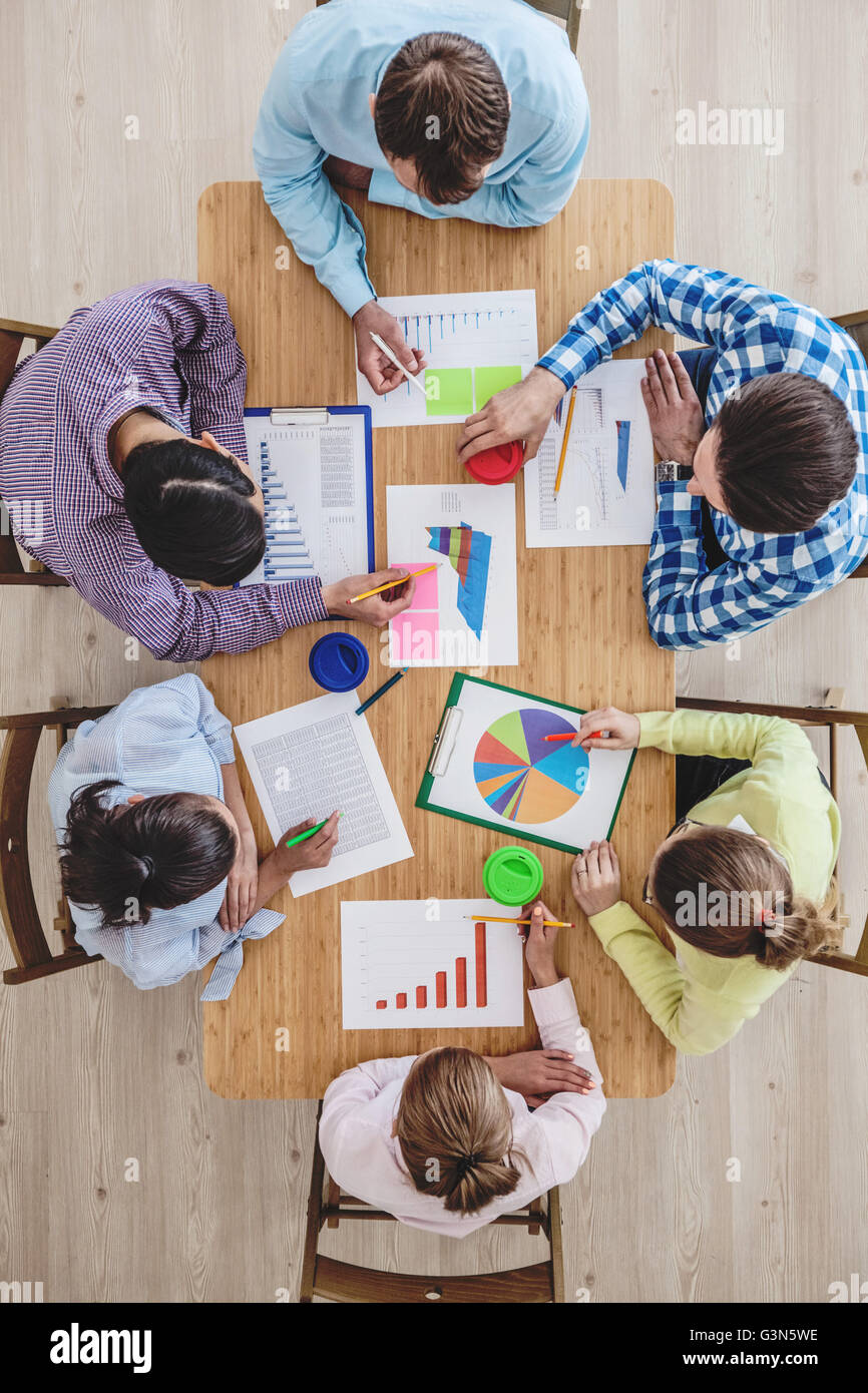 Diverse people working with financial reports Stock Photo - Alamy