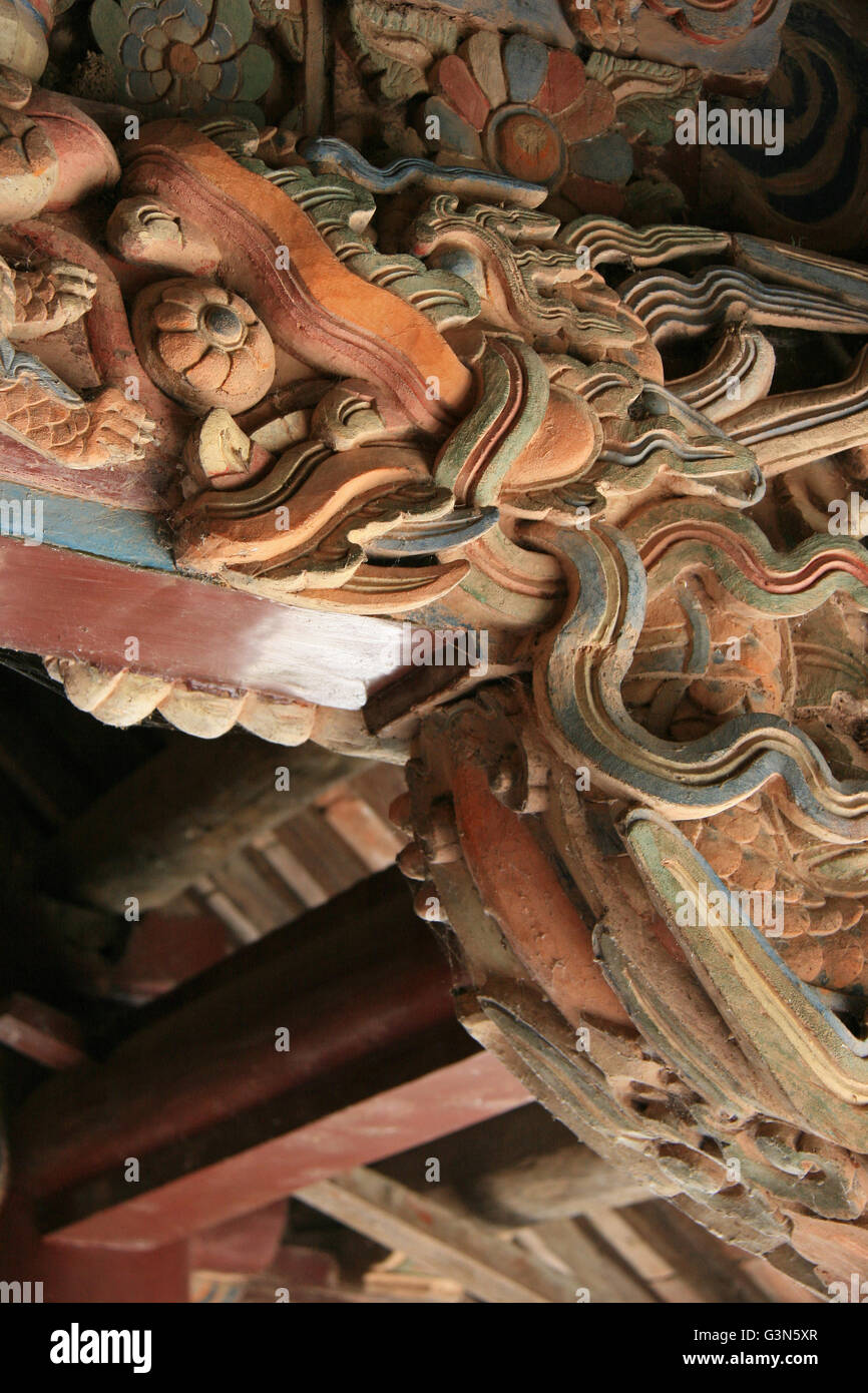 Sculptured dragon decorating the ceiling of the Le Dai Hanh temple in ...