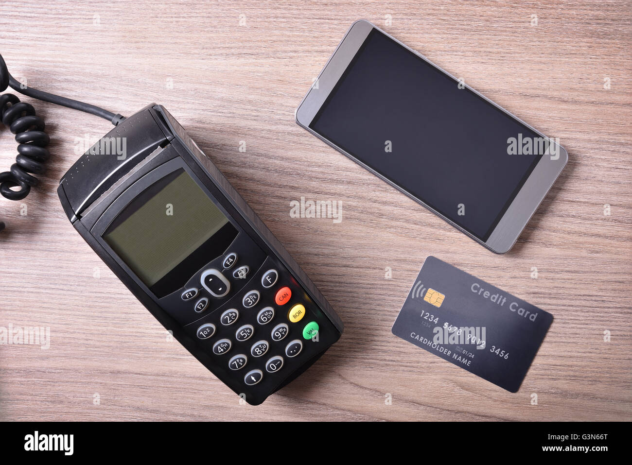 Mobile phone and credit card on wood table. Concept of payment system ...