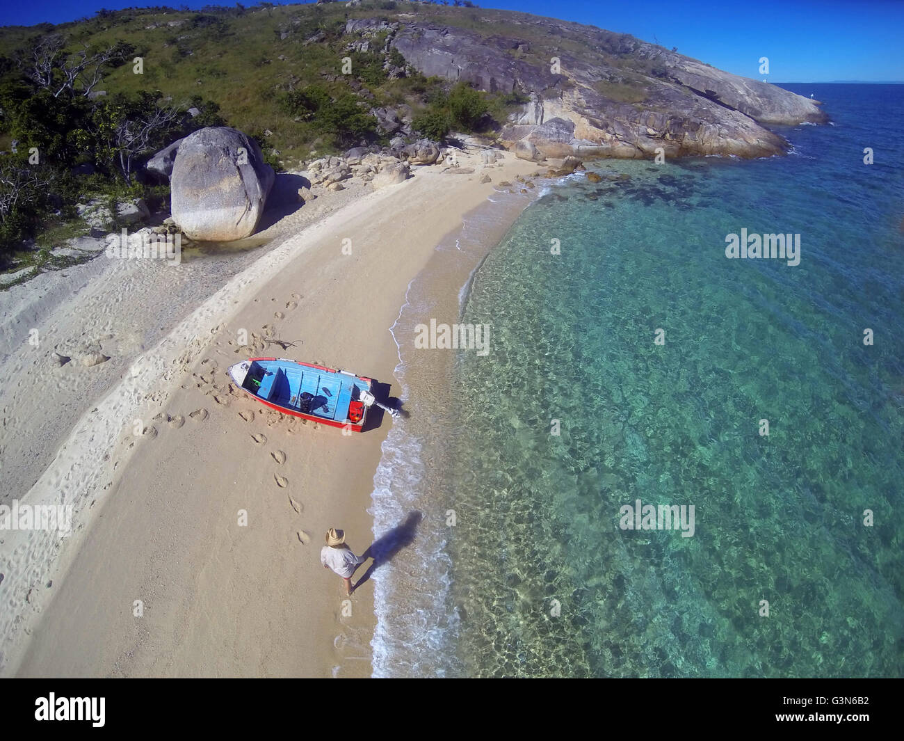 Aerial view of person walking along remote beach, Lizard Island, Great ...