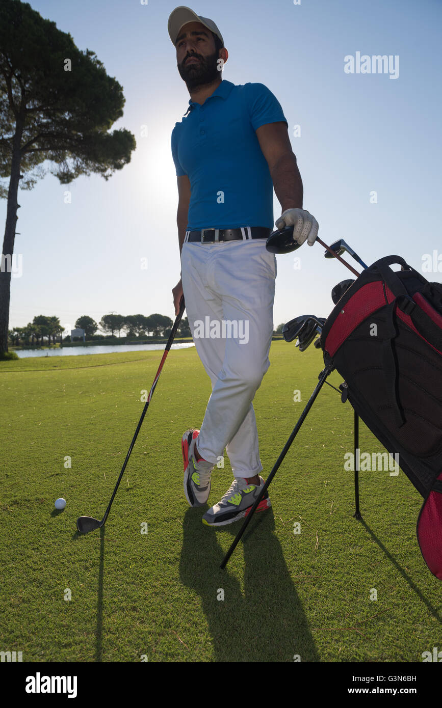 handsome middle eastern golf player portrait at course on beautiful ...