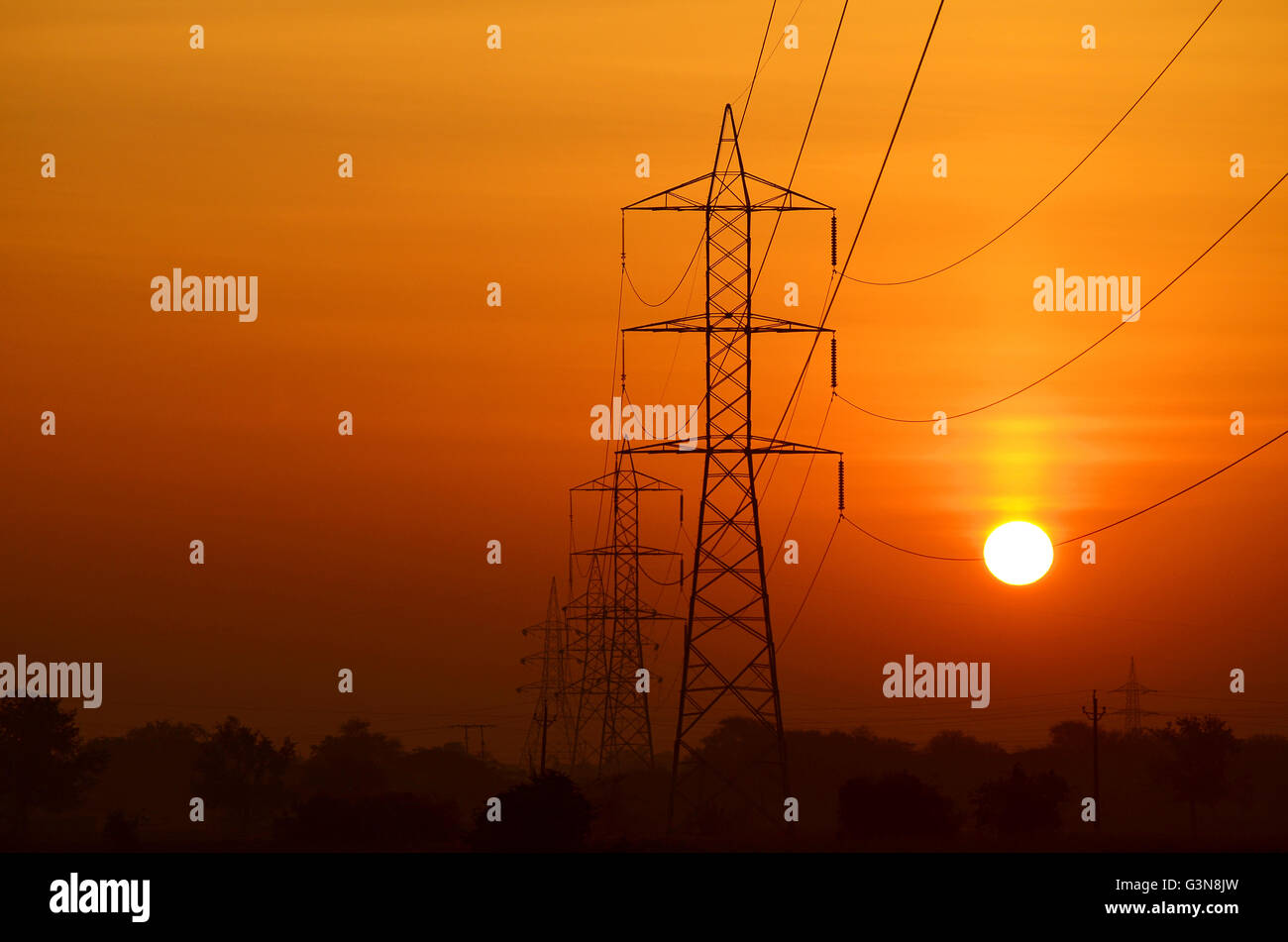 Power poles lines in sunrise, Gujarat, India Stock Photo - Alamy