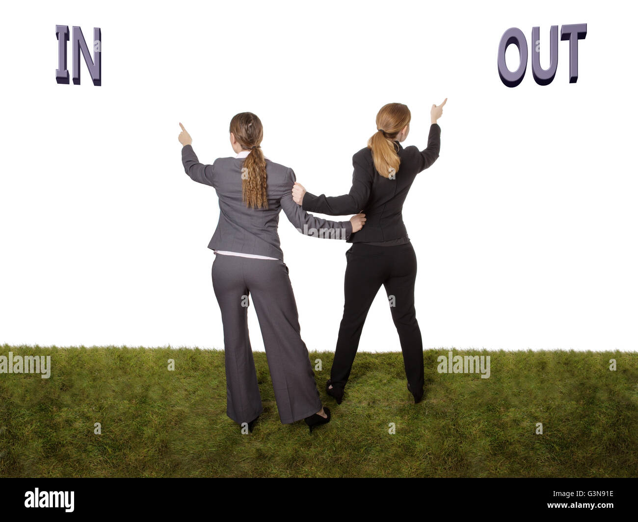 Full length studio shot of two business women, taken from behind ...