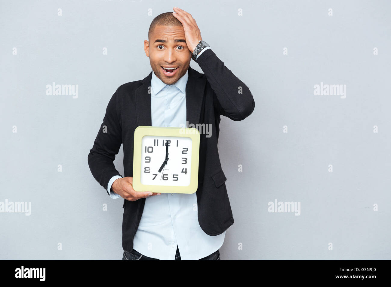 Worried man and clock hi-res stock photography and images - Alamy