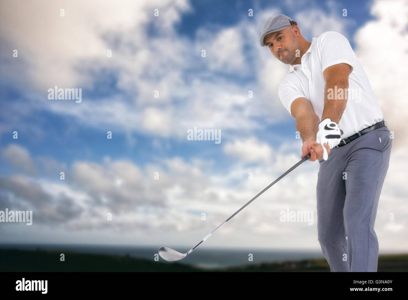 Golf player taking a shot Stock Photo - Alamy