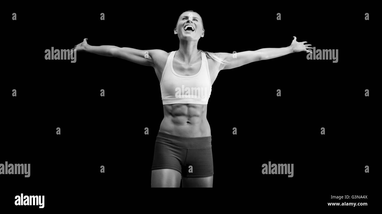 Fit woman celebrating victory with arms stretched Stock Photo - Alamy
