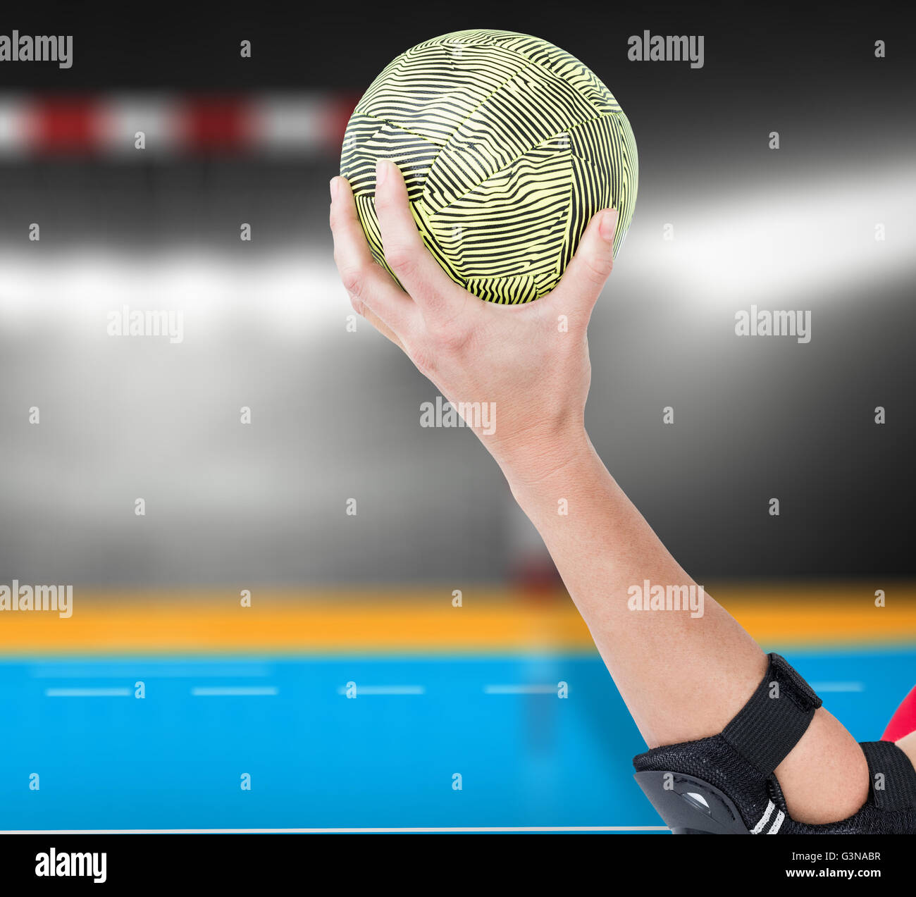 Composite image of female athlete with elbow pad holding handball Stock ...