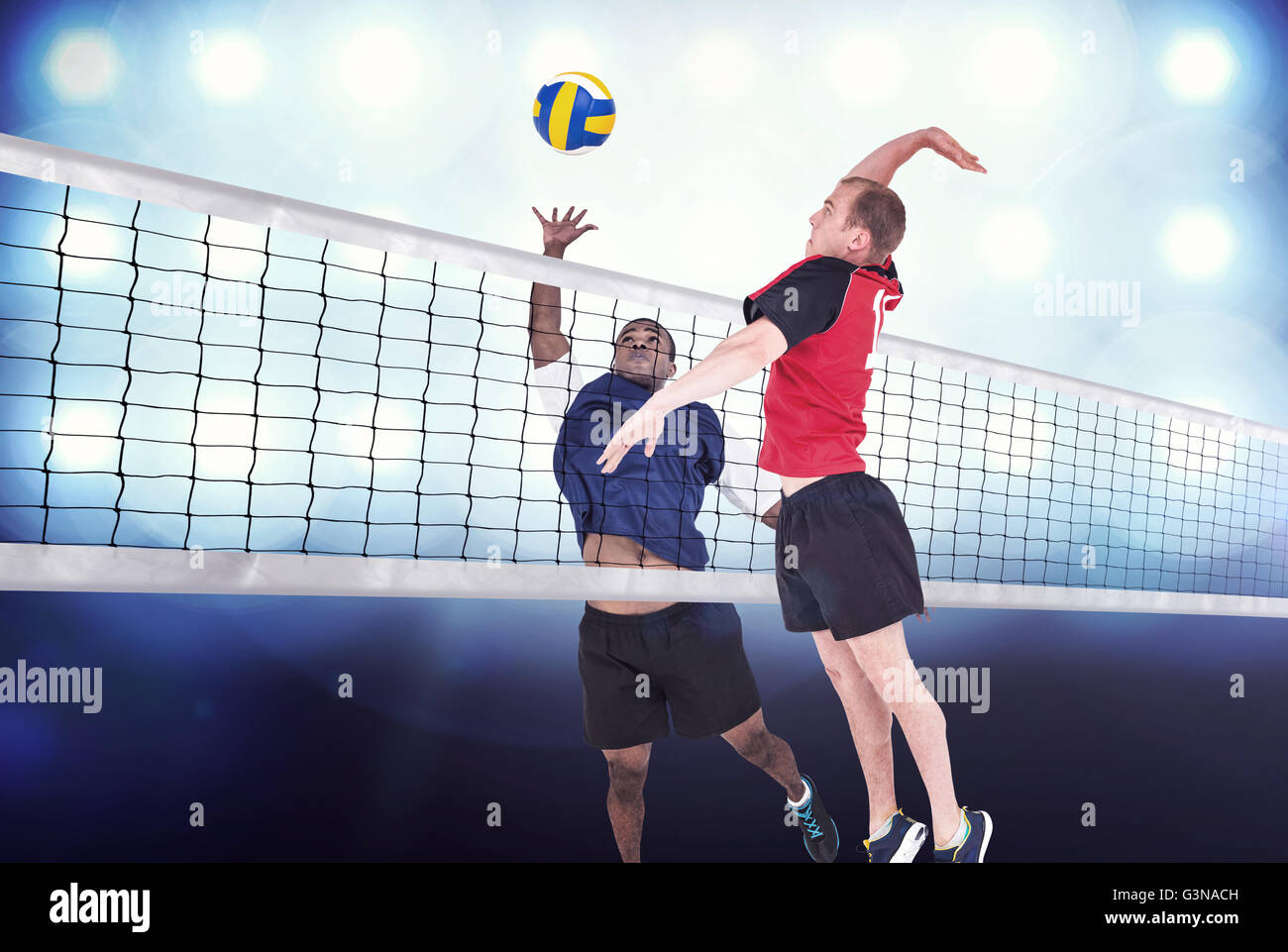 Composite image of sportsman hitting volleyball Stock Photo - Alamy