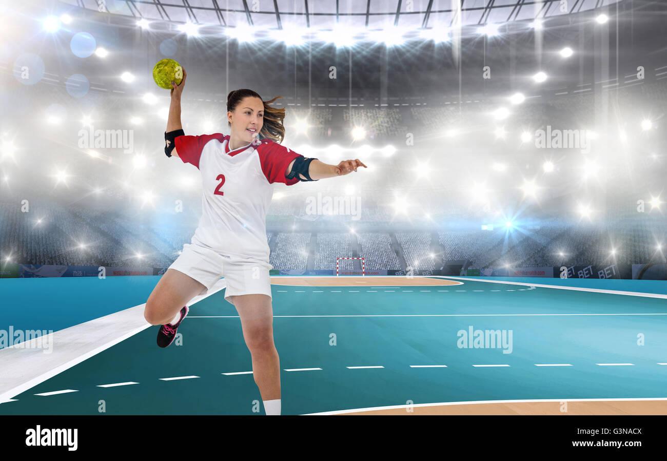 Sportswoman throwing a ball Stock Photo - Alamy