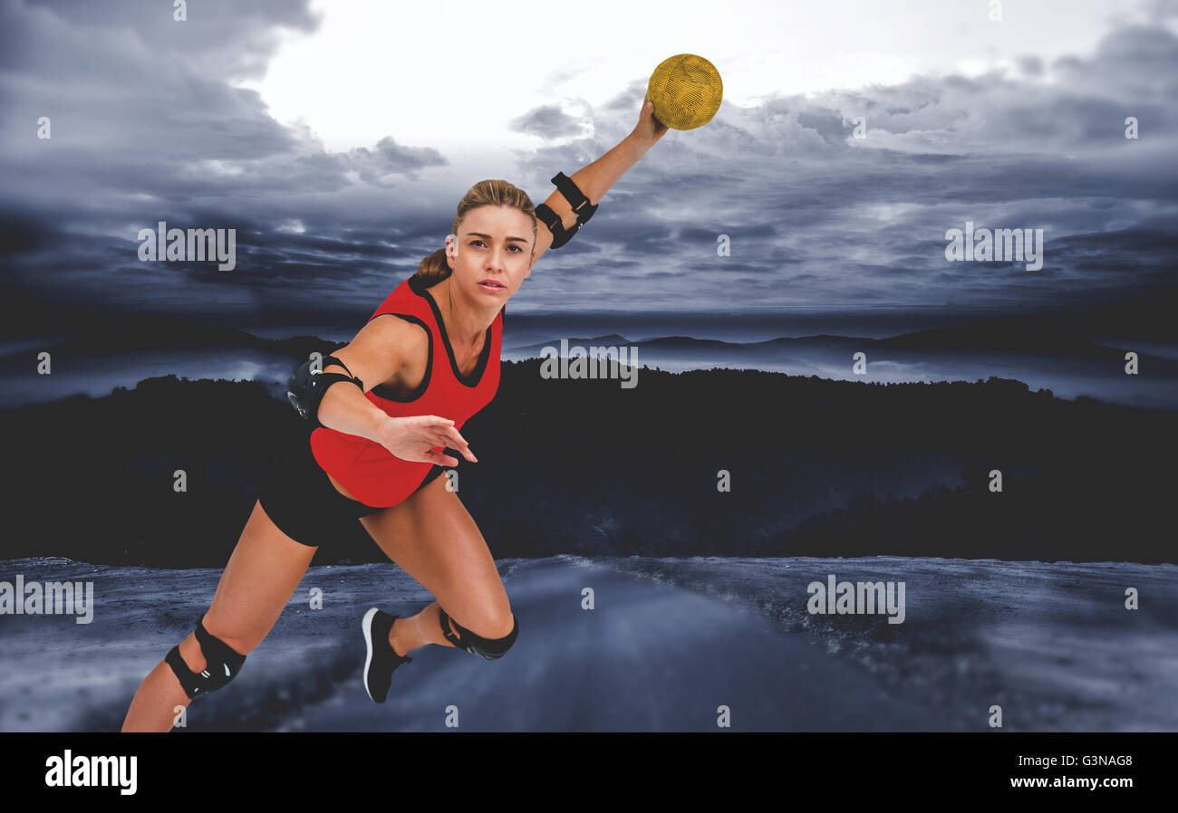 Composite image of female athlete throwing handball Stock Photo - Alamy
