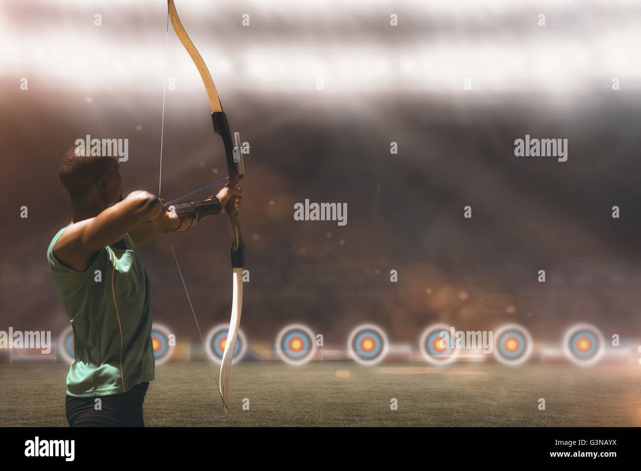 Rear view of sportsman doing archery Stock Photo - Alamy