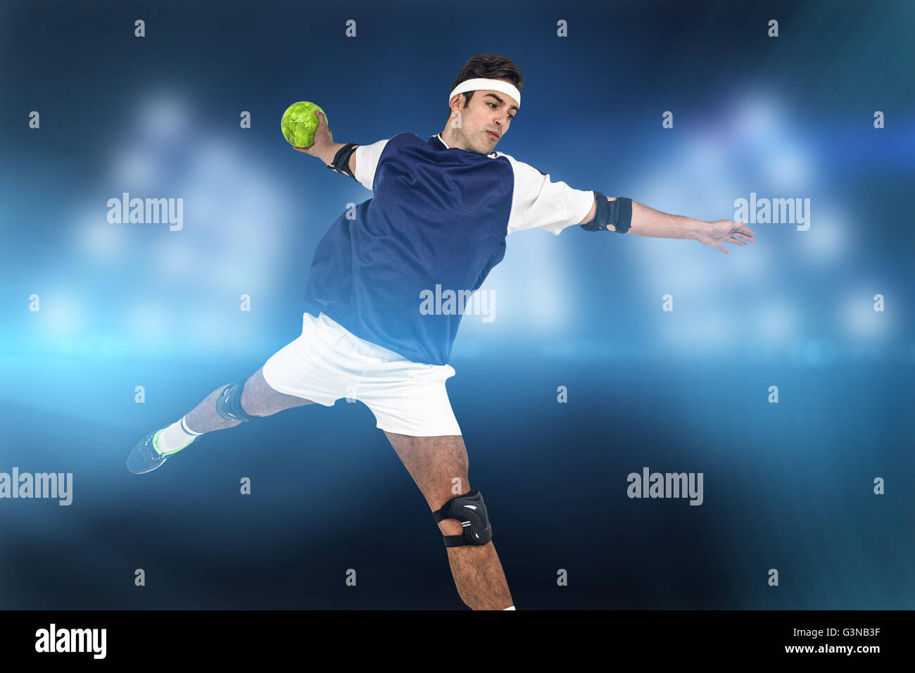 Composite image of sportsman throwing a ball Stock Photo - Alamy