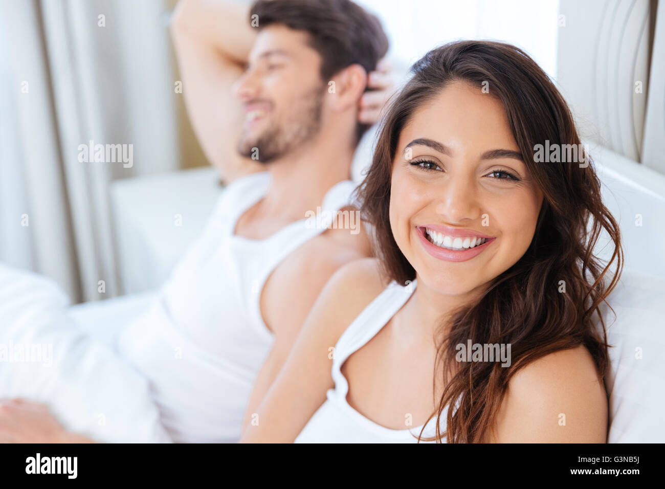 Mid adult couple lying in bed hi-res stock photography and images - Alamy