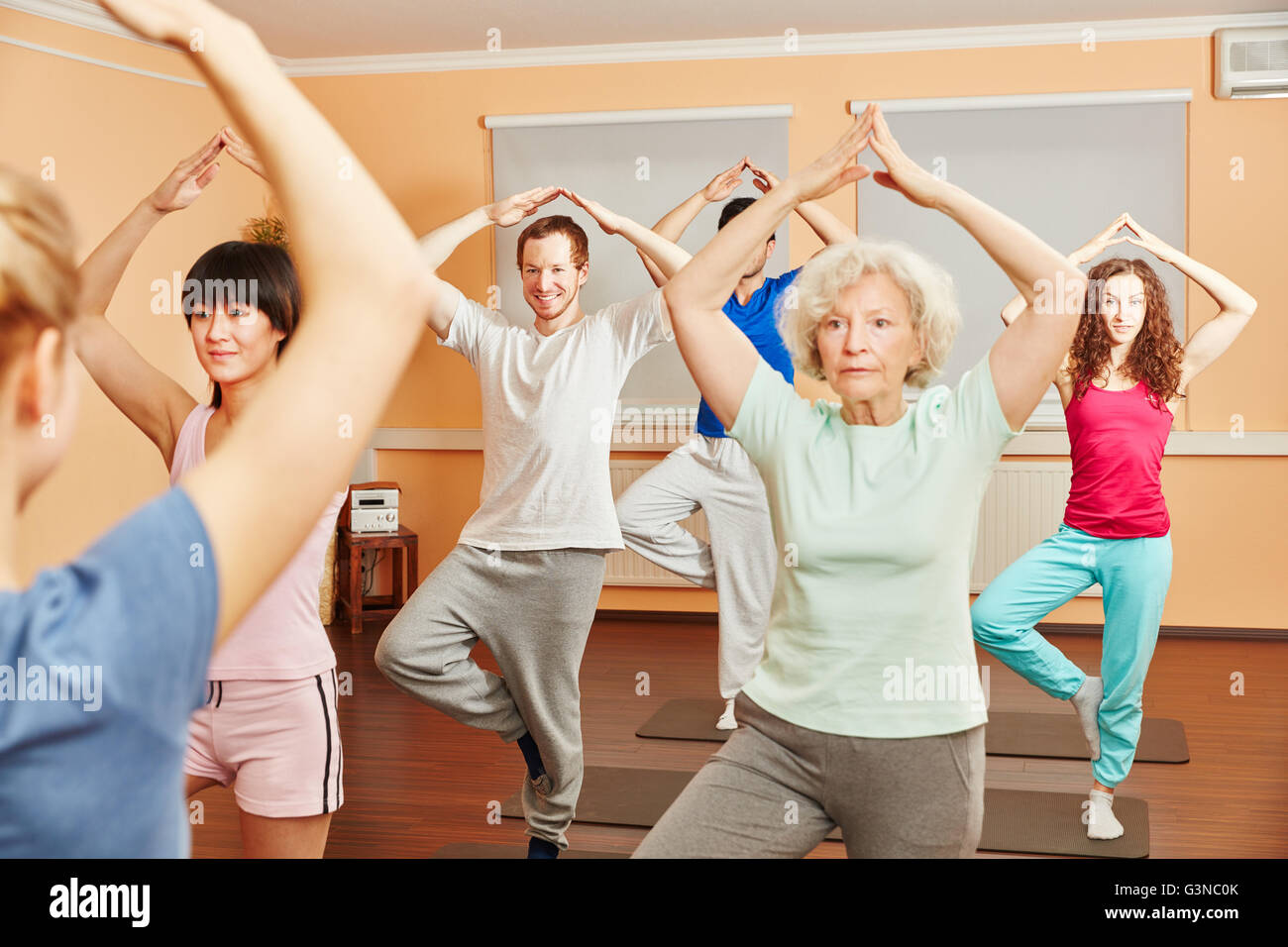 Old woman yoga hi-res stock photography and images - Alamy