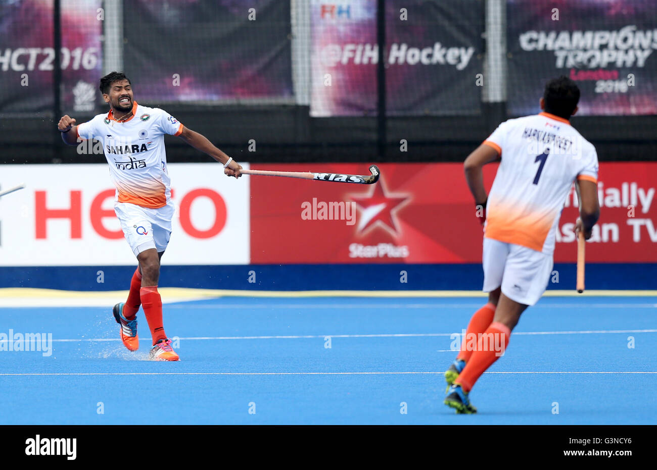 India's Devindar Walmiki (left) celebrates scoring his side's first ...