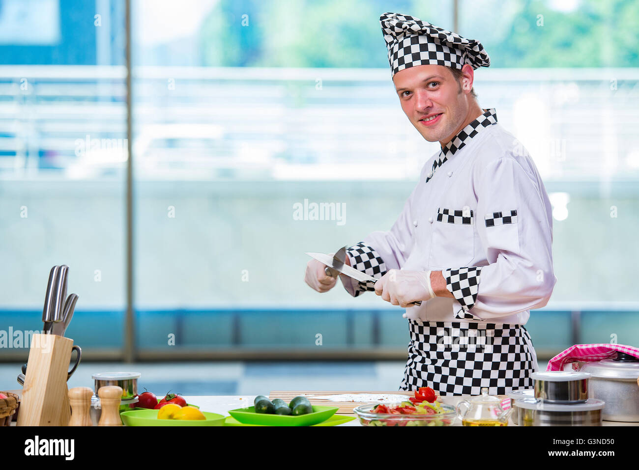 Male cook preparing food in the kitchen Stock Photo - Alamy