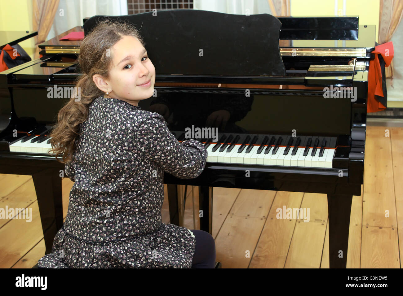 Girl playing piano Stock Photo - Alamy