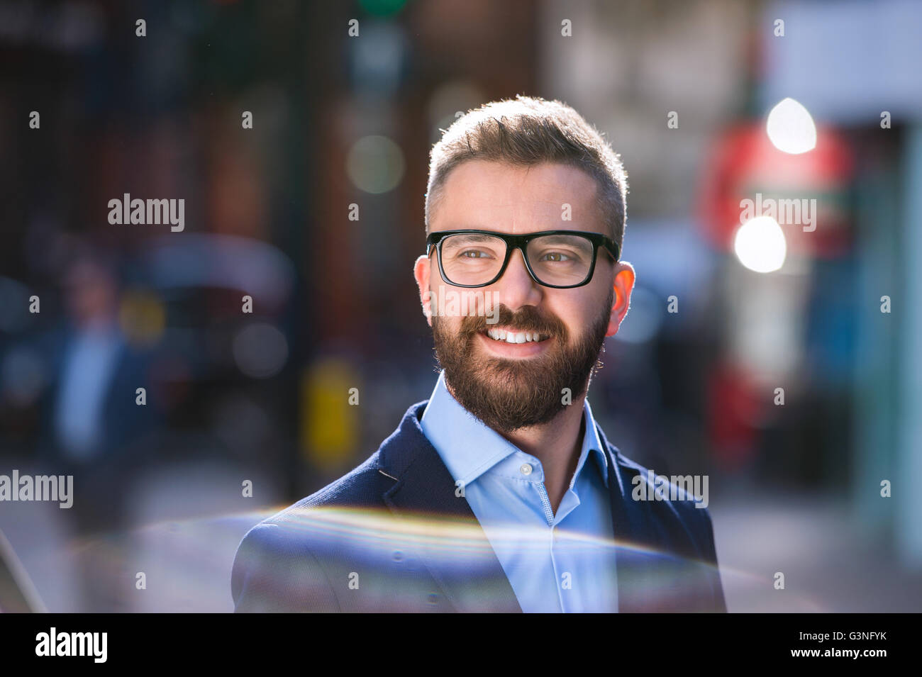 Hipster manager in blue shirt walking in the street Stock Photo - Alamy