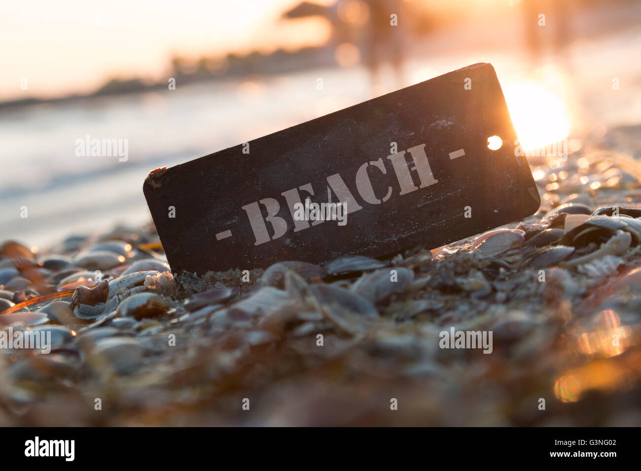 Beach Sign and sunset Stock Photo - Alamy