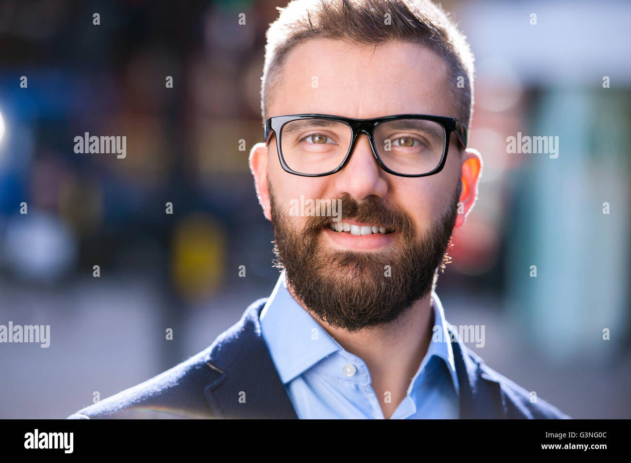 Hipster manager in blue shirt walking in the street Stock Photo - Alamy