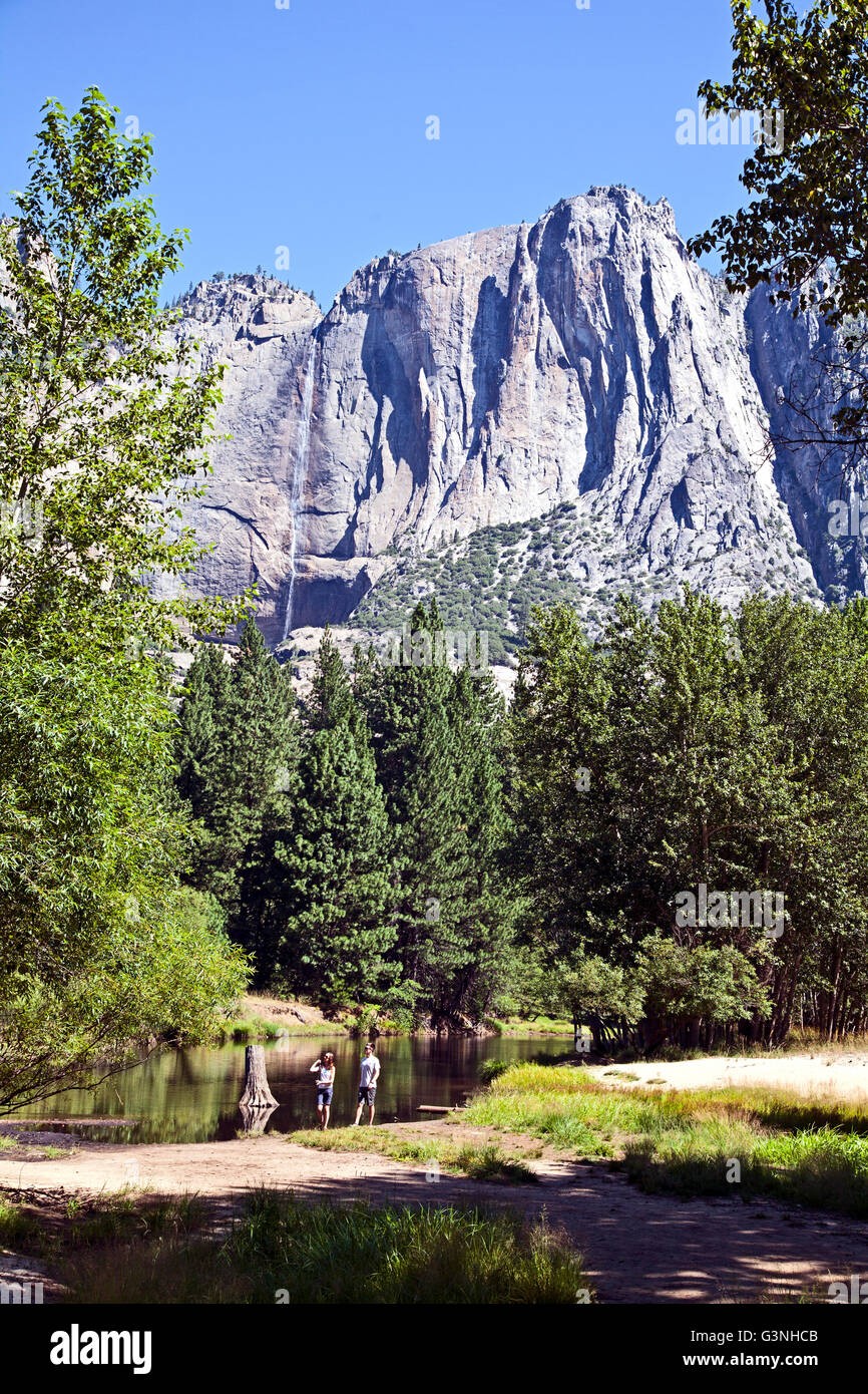 Walking along the Merced River, below Lower Brother mountain, along ...