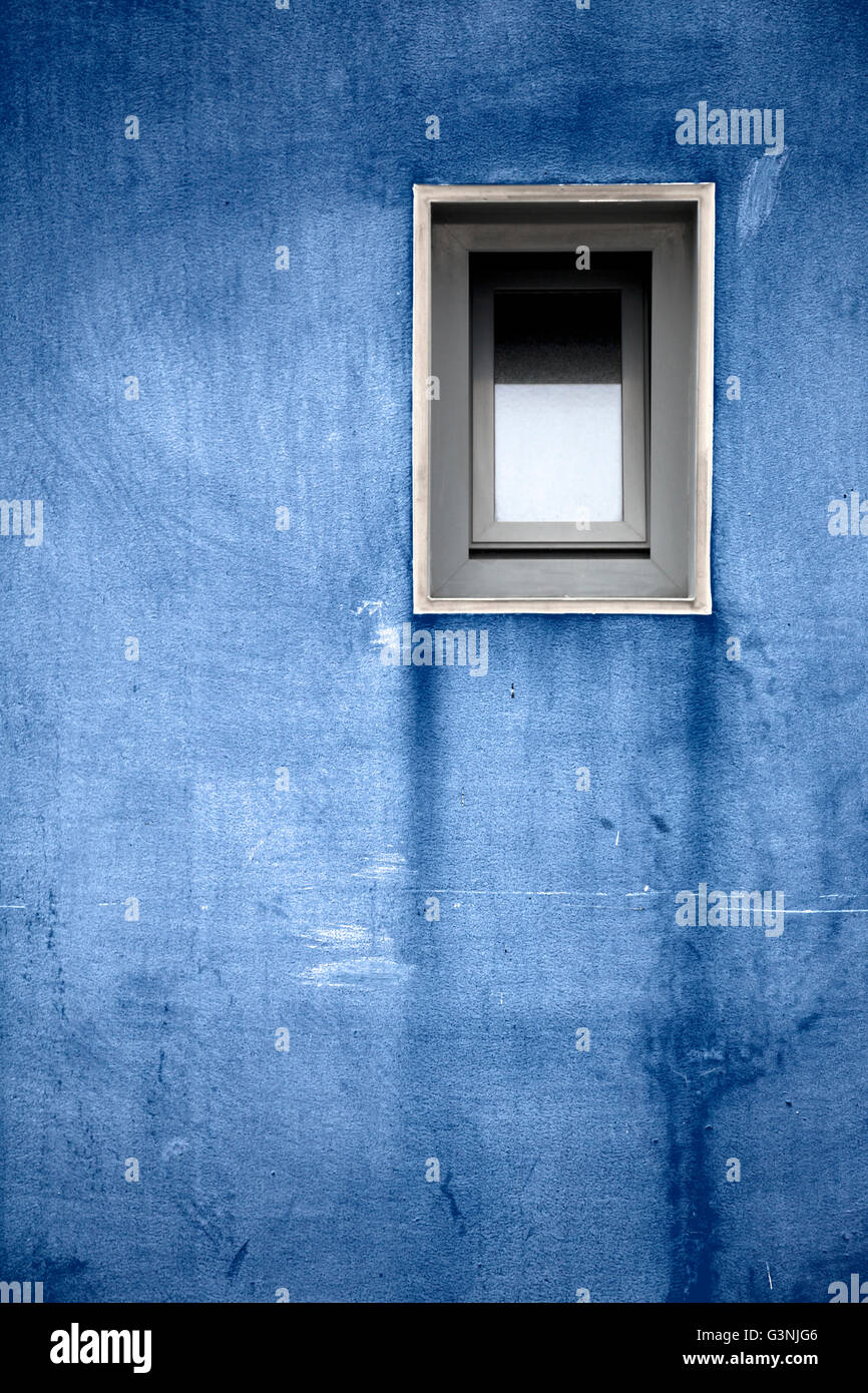 Blue wall with a window Stock Photo - Alamy