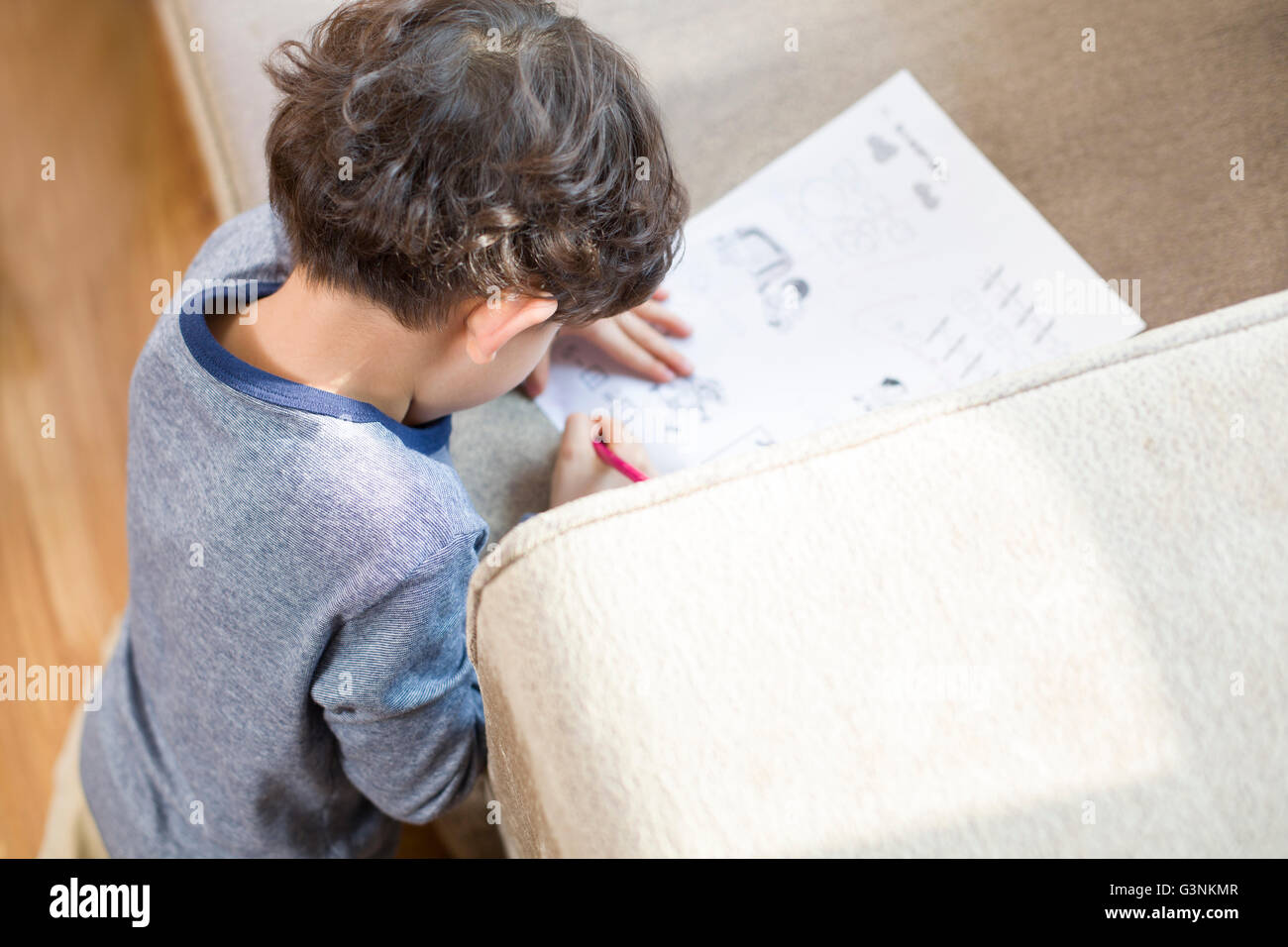 Little boy doing homework Stock Photo - Alamy