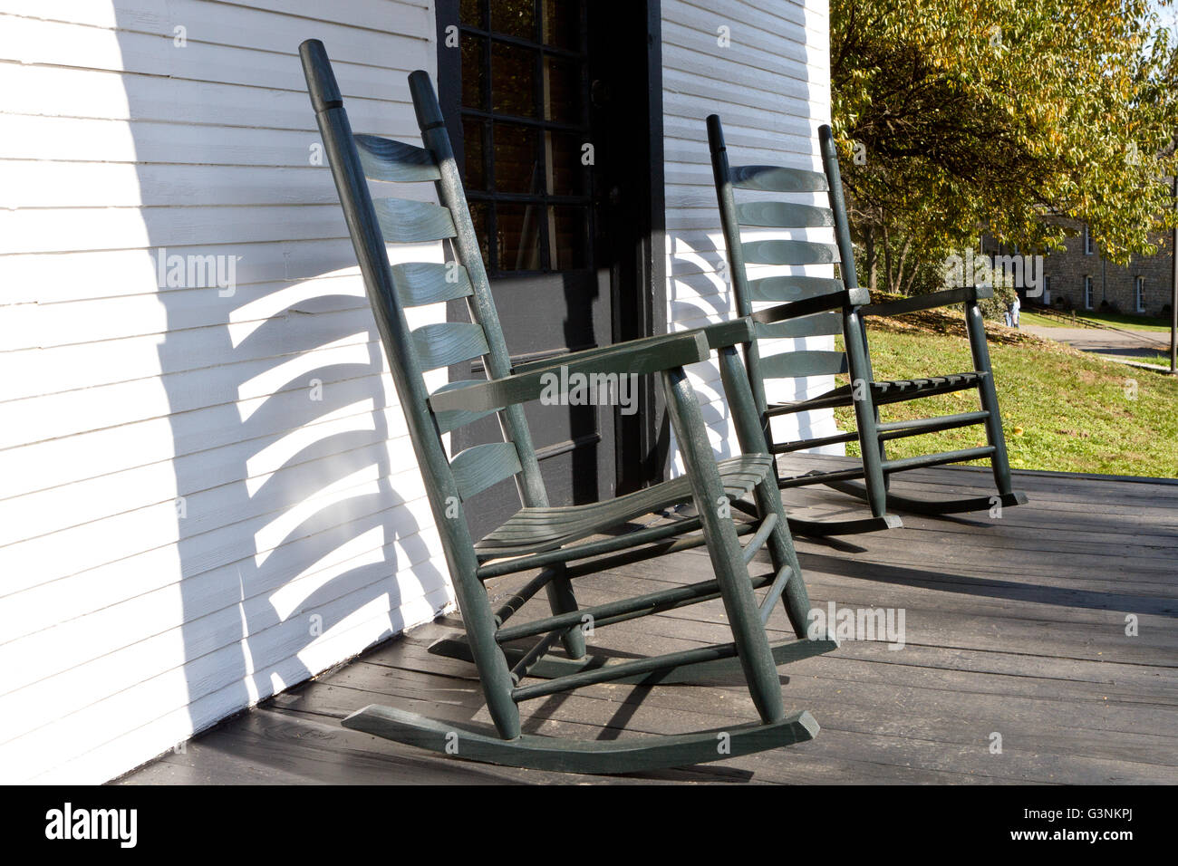 Traditional wood rocking chairs on the front porch Stock Photo - Alamy