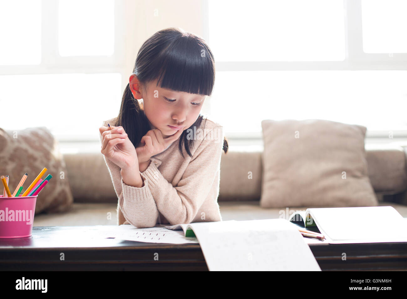 Little girl doing homework Stock Photo - Alamy Little girl doing homework Stock Photo - Alamy