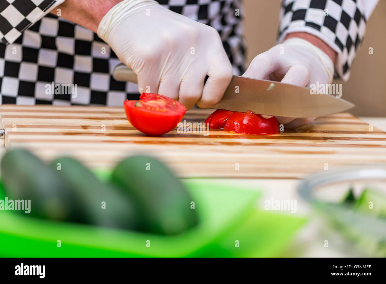 Male cook preparing food in the kitchen Stock Photo - Alamy