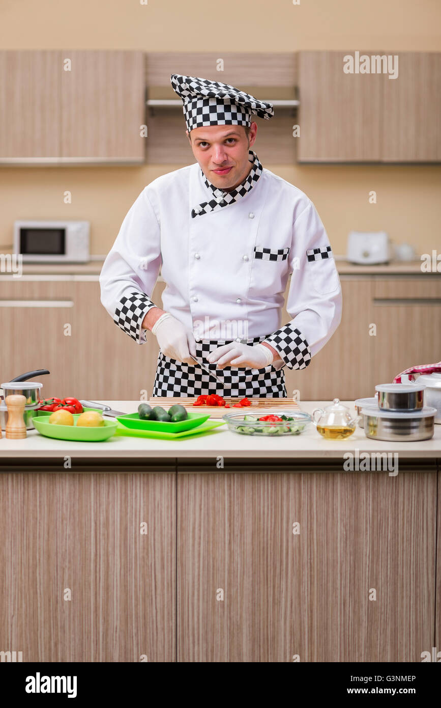 Male cook preparing food in the kitchen Stock Photo - Alamy