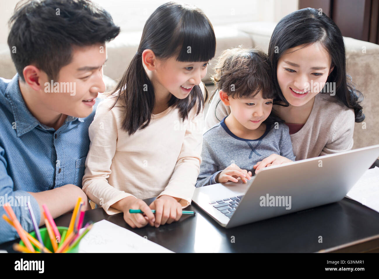 Indian parents children home laptop hi-res stock photography and images ...