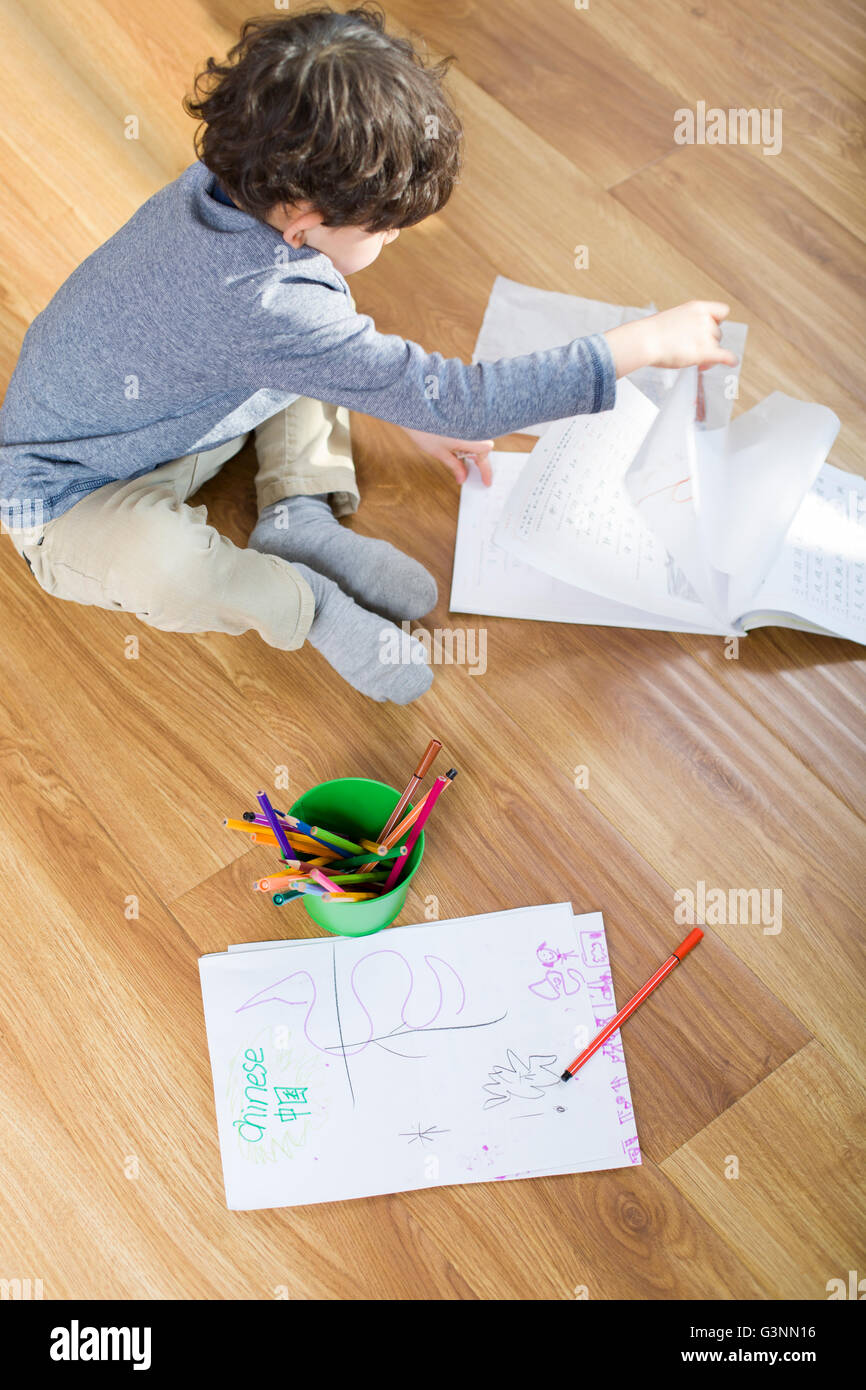 Little boy doing homework Stock Photo - Alamy
