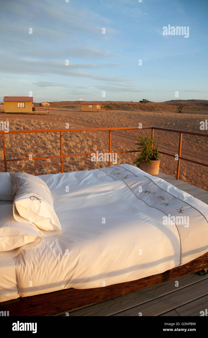 Bed at Namib Desert Star Dune Camp in Namibia Stock Photo - Alamy