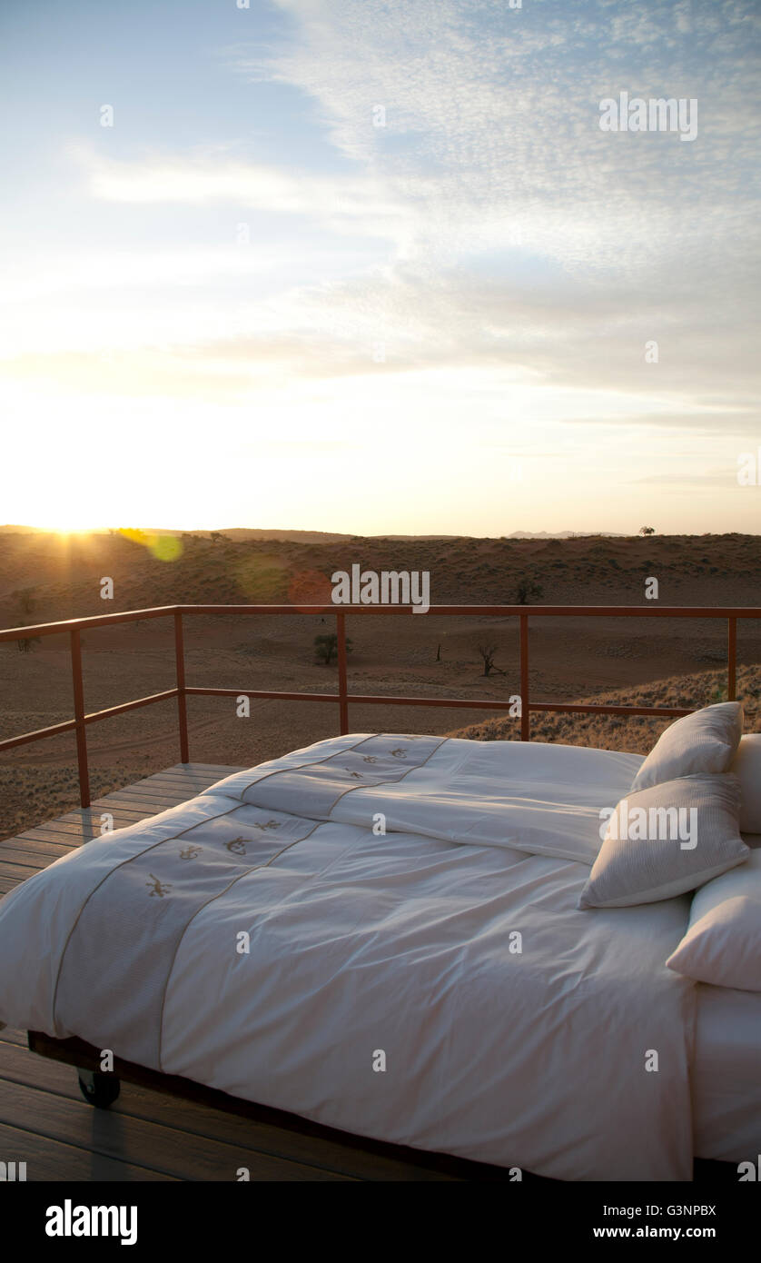 Bed at Namib Desert Star Dune Camp in Namibia Stock Photo - Alamy