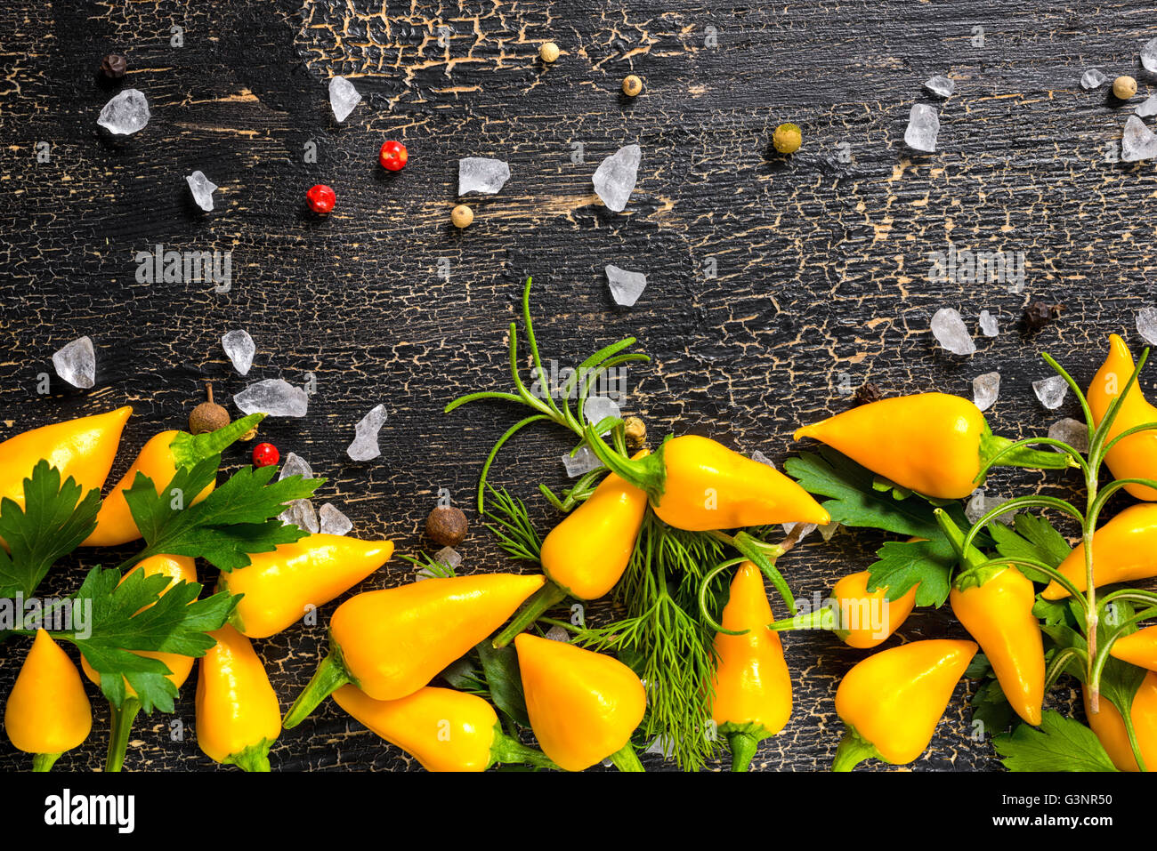 flat lay of decorative yellow spices, dry peppers, sea salt, different ...